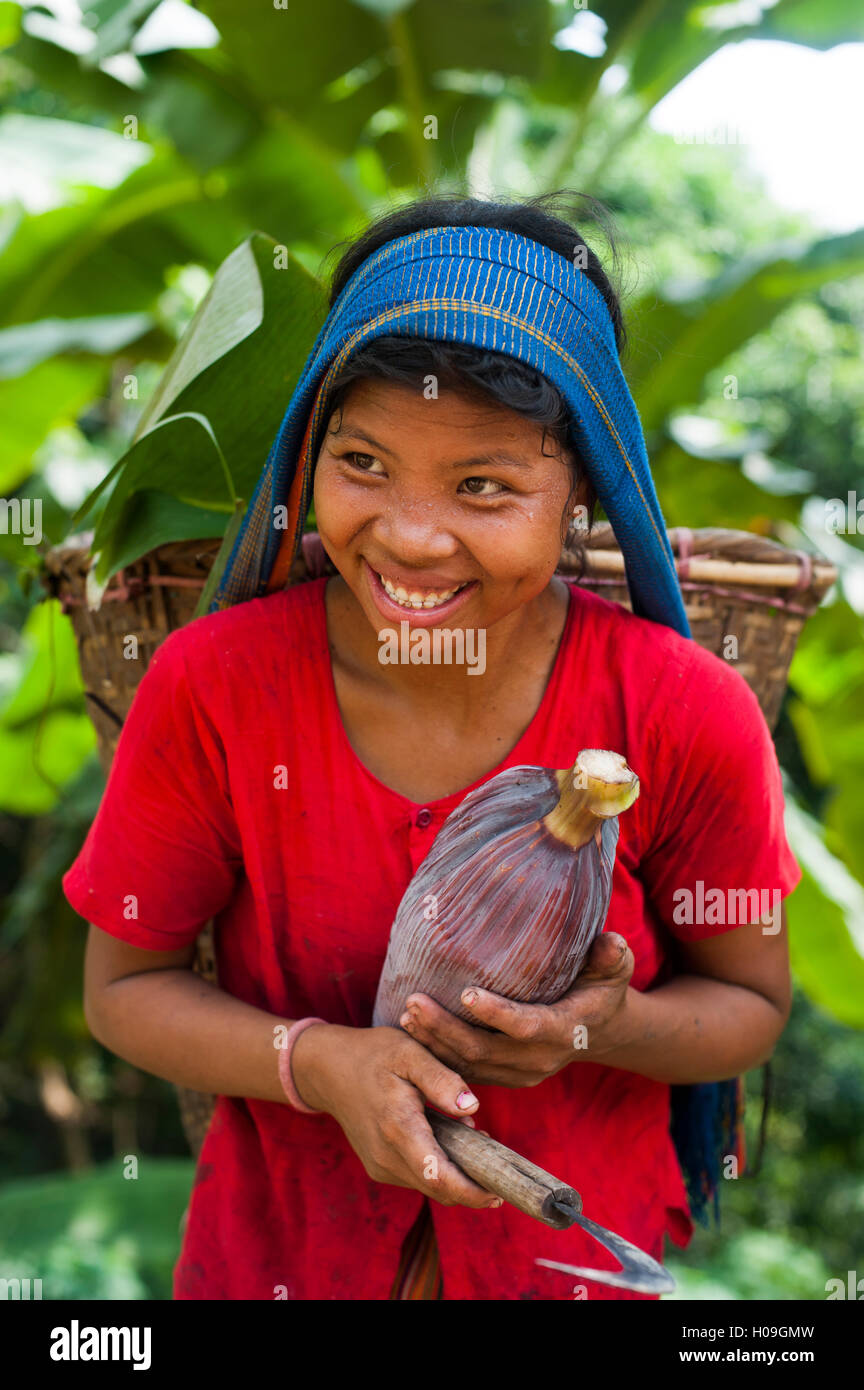 A Chakma girl in the Rangamati area in Bangladesh collects banana ...