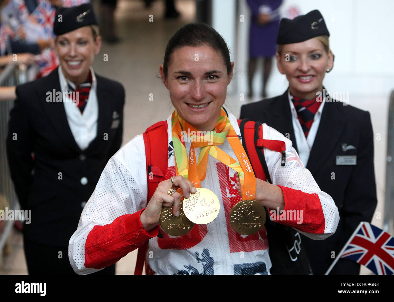Great Britain's Sarah Storey shows off her medals as she arrives back ...