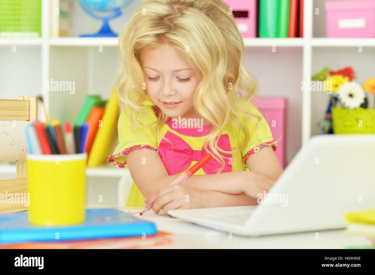 student girl with books and laptop Stock Photo - Alamy