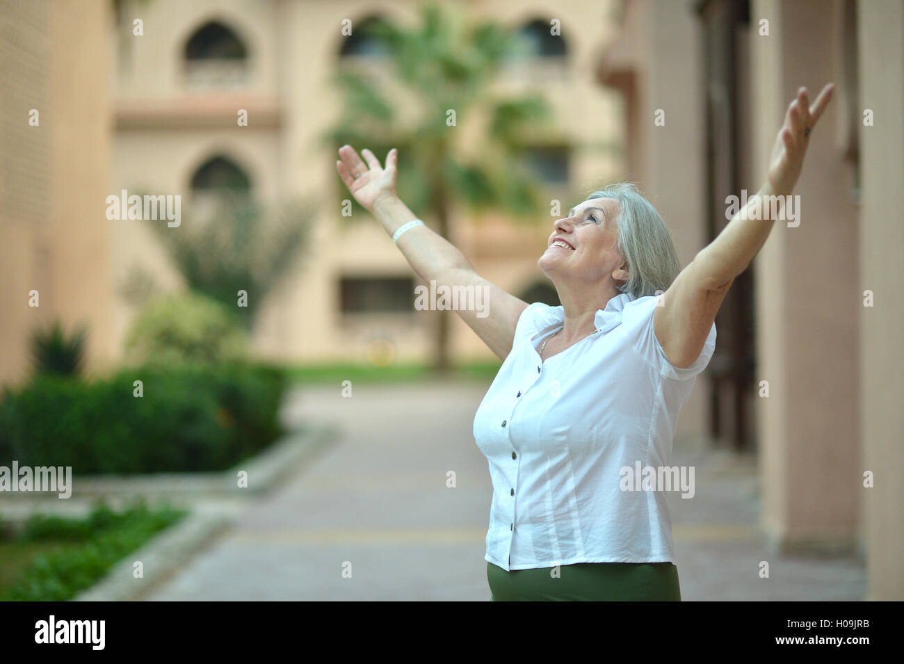 elderly woman at tropical resort Stock Photo - Alamy