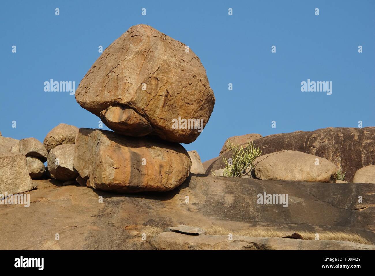 Big balancing granite boulder in Hampi, India. Popular area for ...