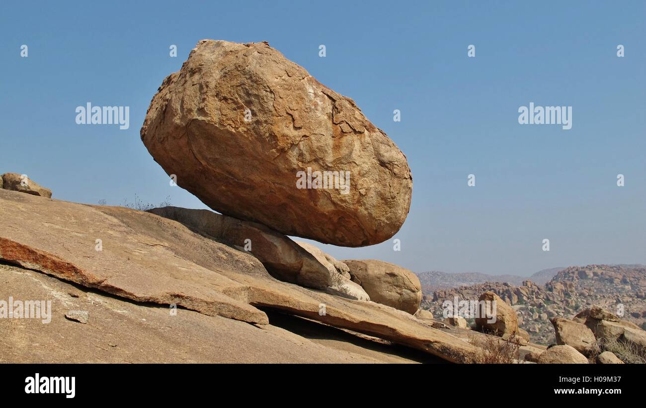 Big balancing granite boulder in Hampi, India. Popular area for ...