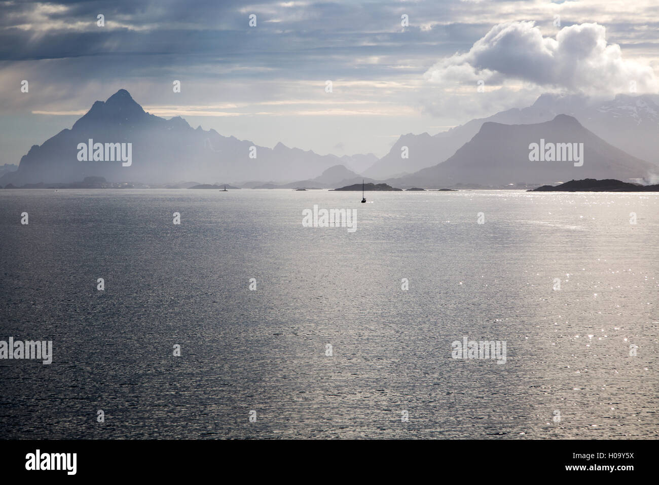 Sunshine over sea and mountain scenery lofoten islands hi-res stock ...
