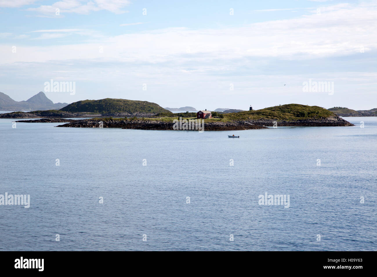 Farmhouse on small skerry island near Stormolla island, Lofoten islands ...