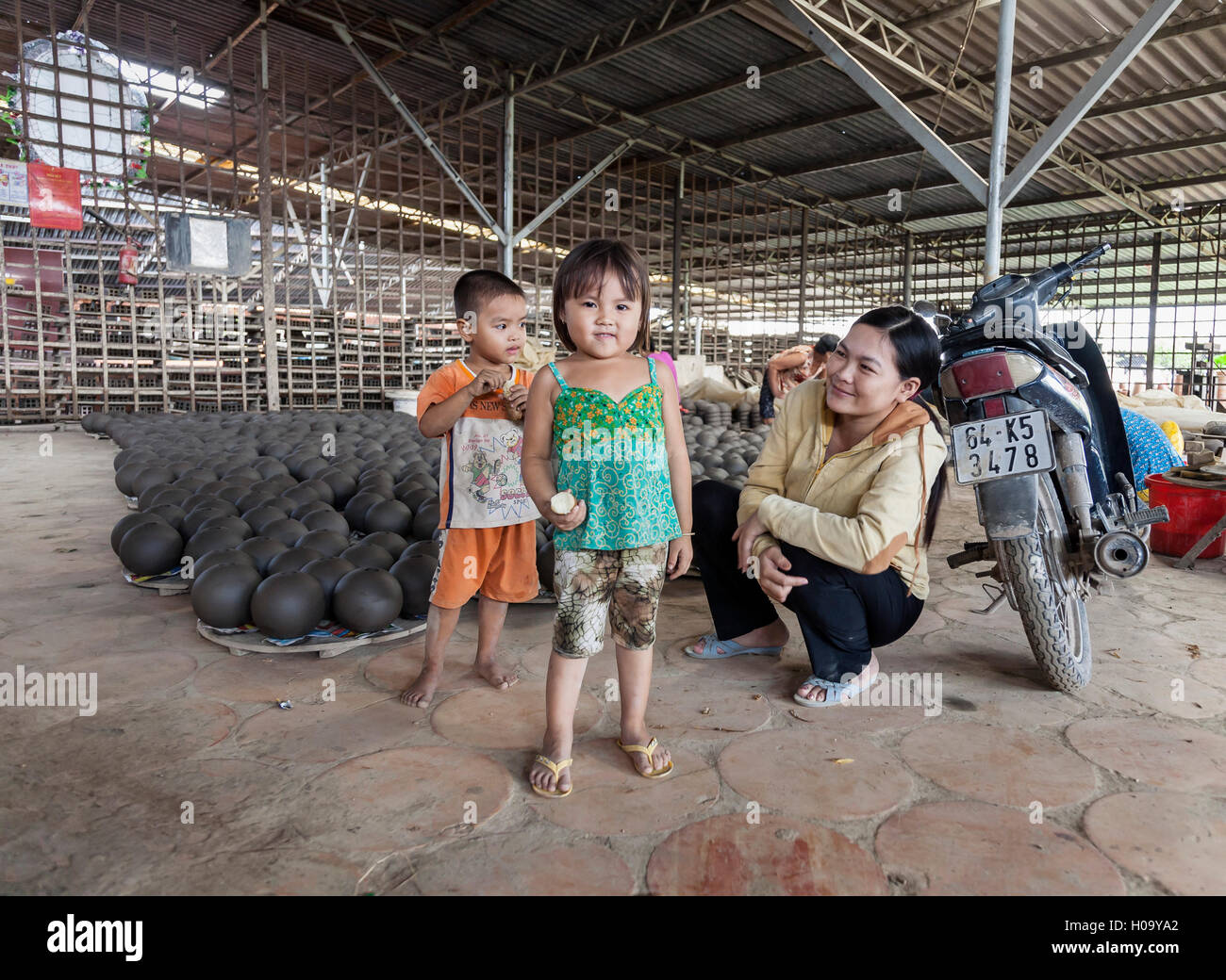 Vietnamese children and their mom Stock Photo - Alamy