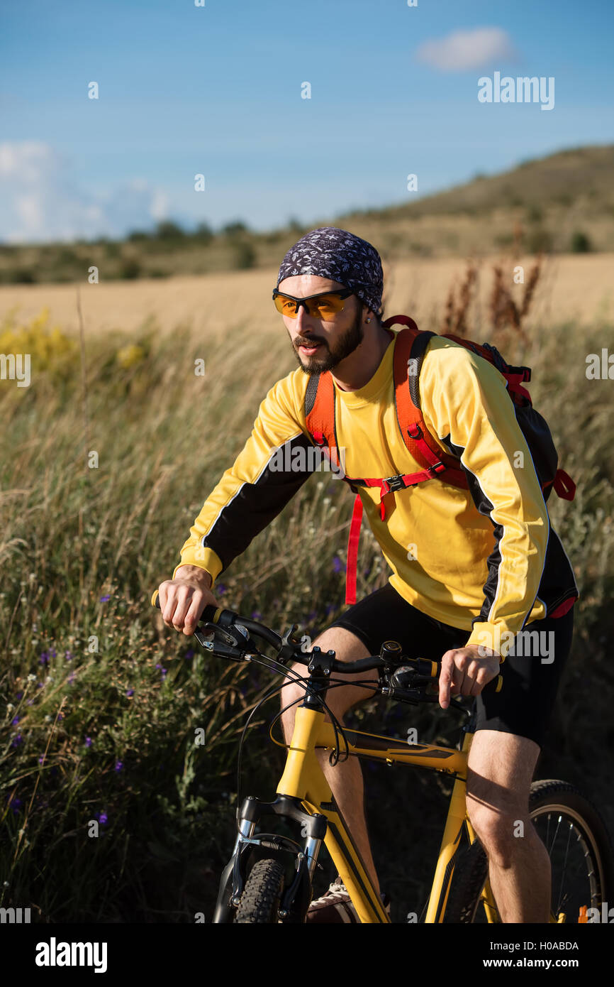 Cyclist Riding the Bike on the Trail in mountains Stock Photo - Alamy