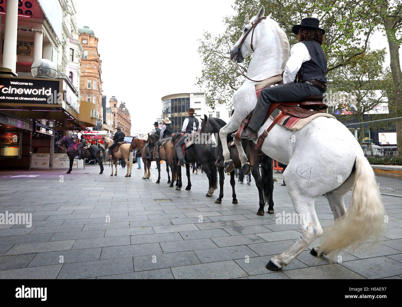 EDITORIAL USE ONLY Seven horse riders, dressed as cowboys, arrive in ...