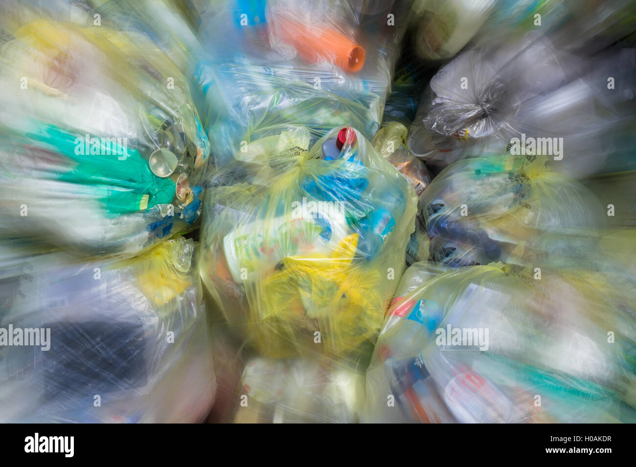 Close Up of garbage and waste in transparent bags, with motion effect ...