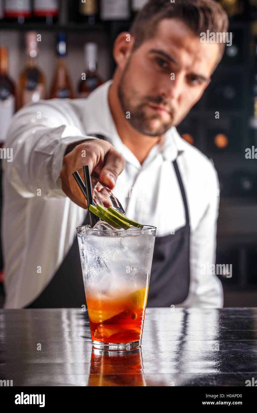 Bartender making and decorating cocktail Stock Photo - Alamy