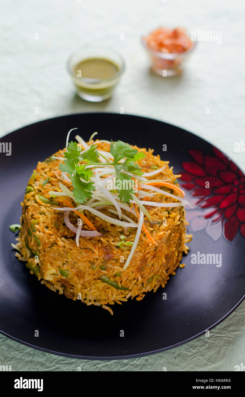 Fried rice on black plate Stock Photo - Alamy