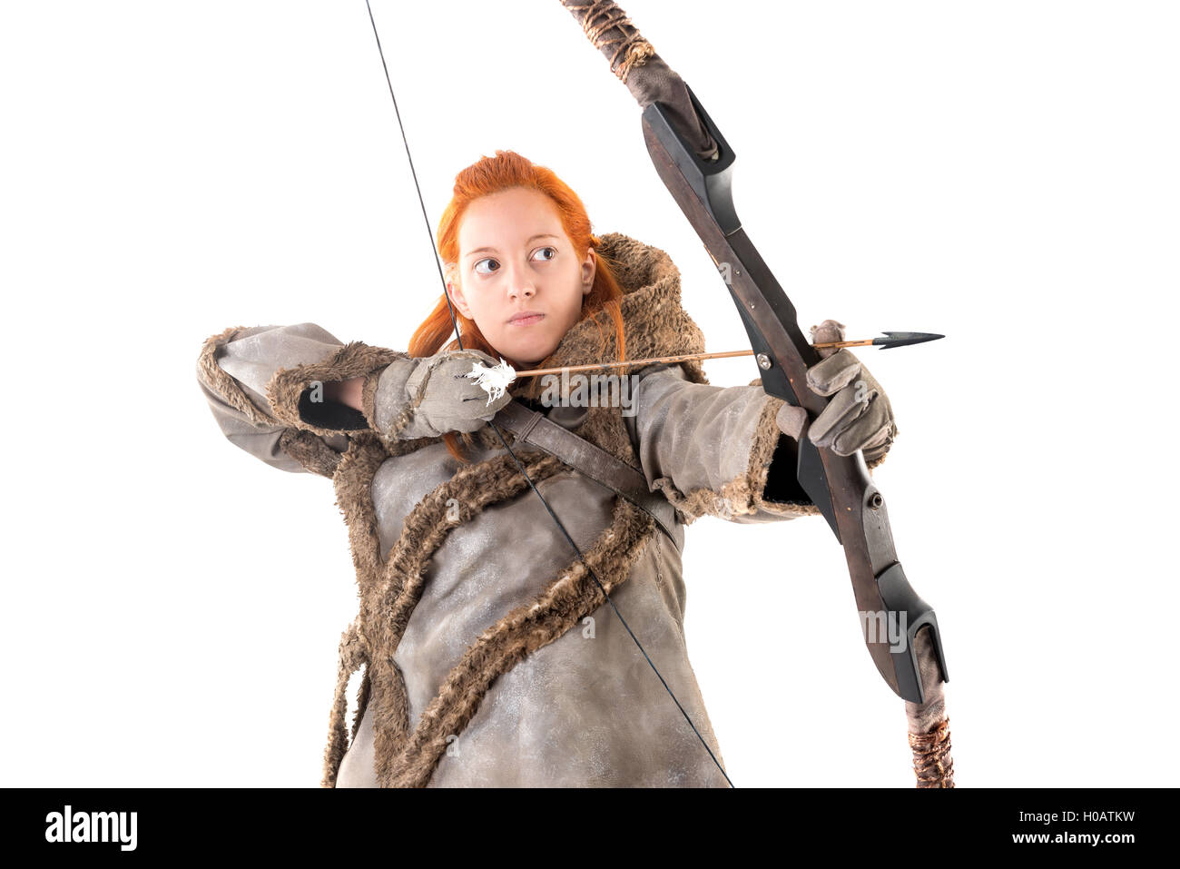girl archer in a costume with bow isolated in white Stock Photo - Alamy