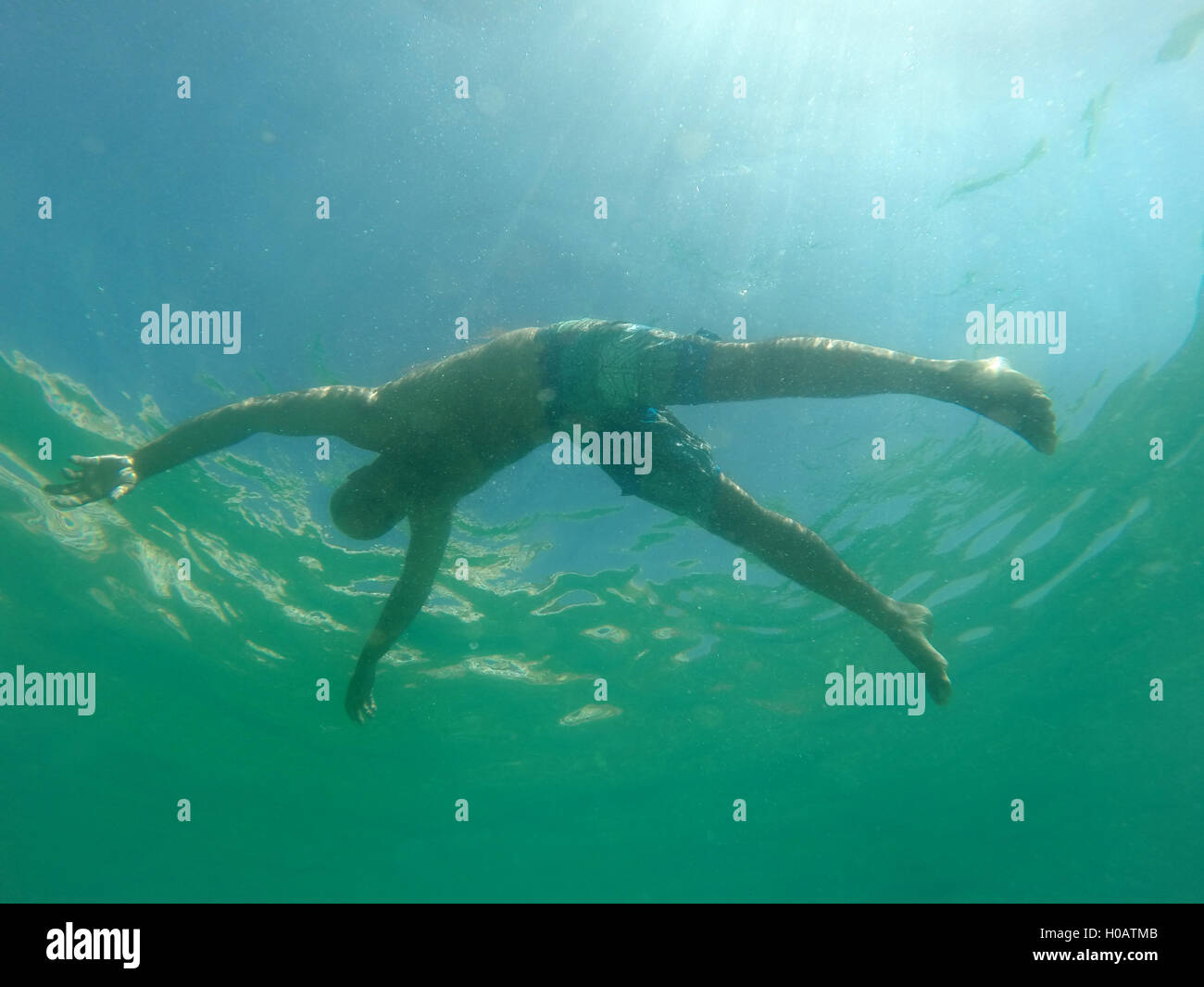 Man drowning viewed from below underwater Stock Photo - Alamy