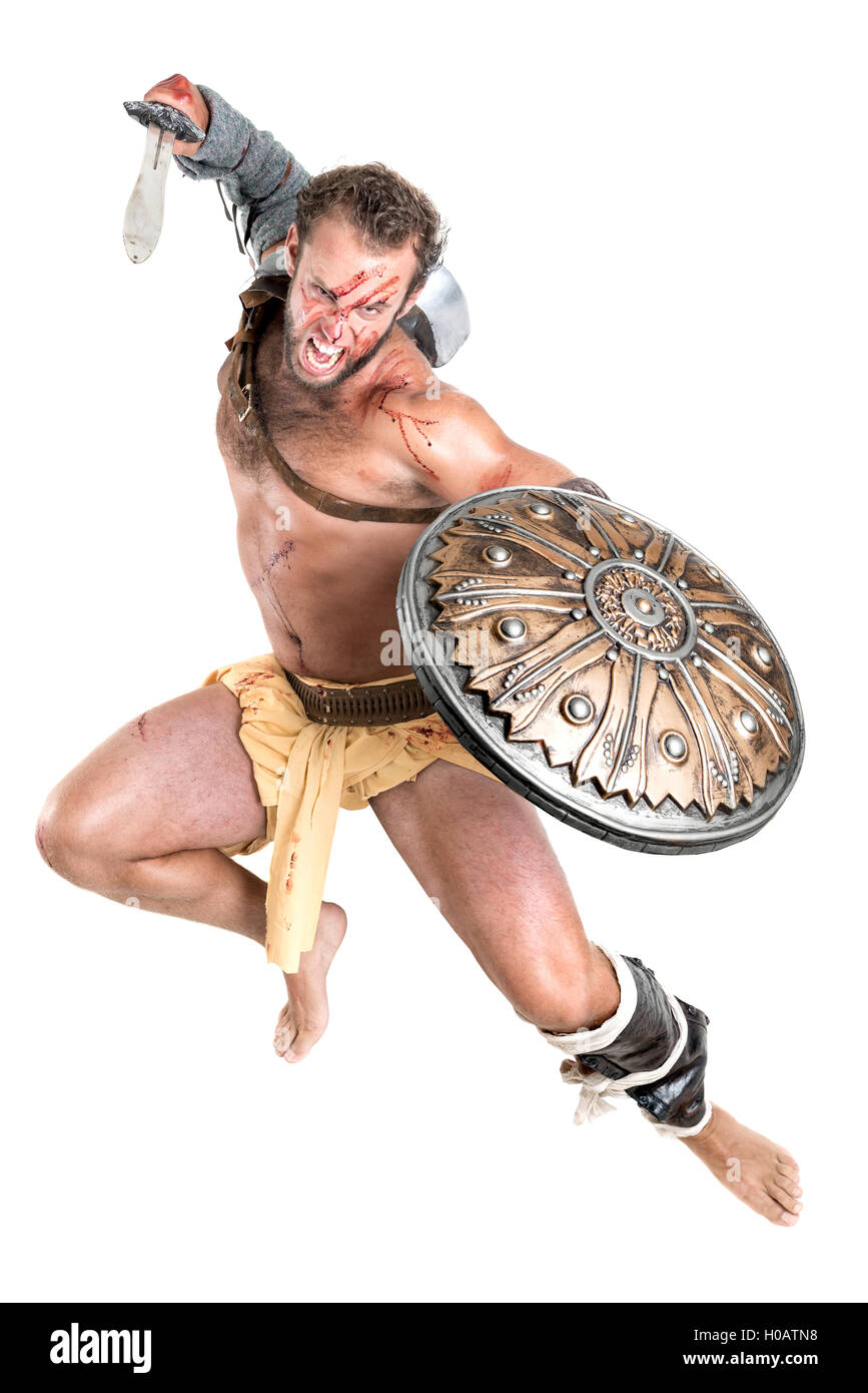 Ancient warrior or Gladiator jumping isolated in a white background ...