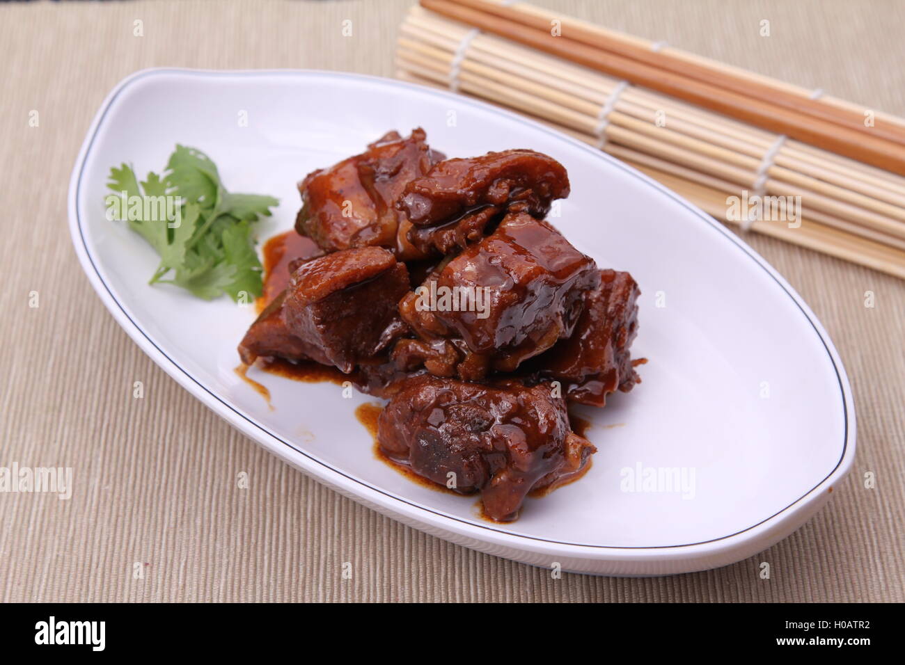 Chinese style of deep fried chicken on white plate on bamboo tray Stock ...