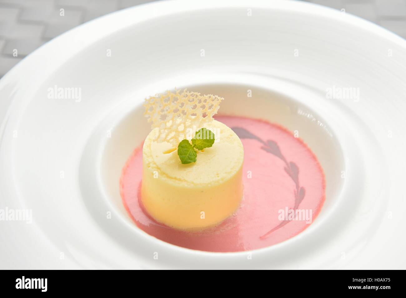 Pudding cake on white plate in restaurant Stock Photo - Alamy