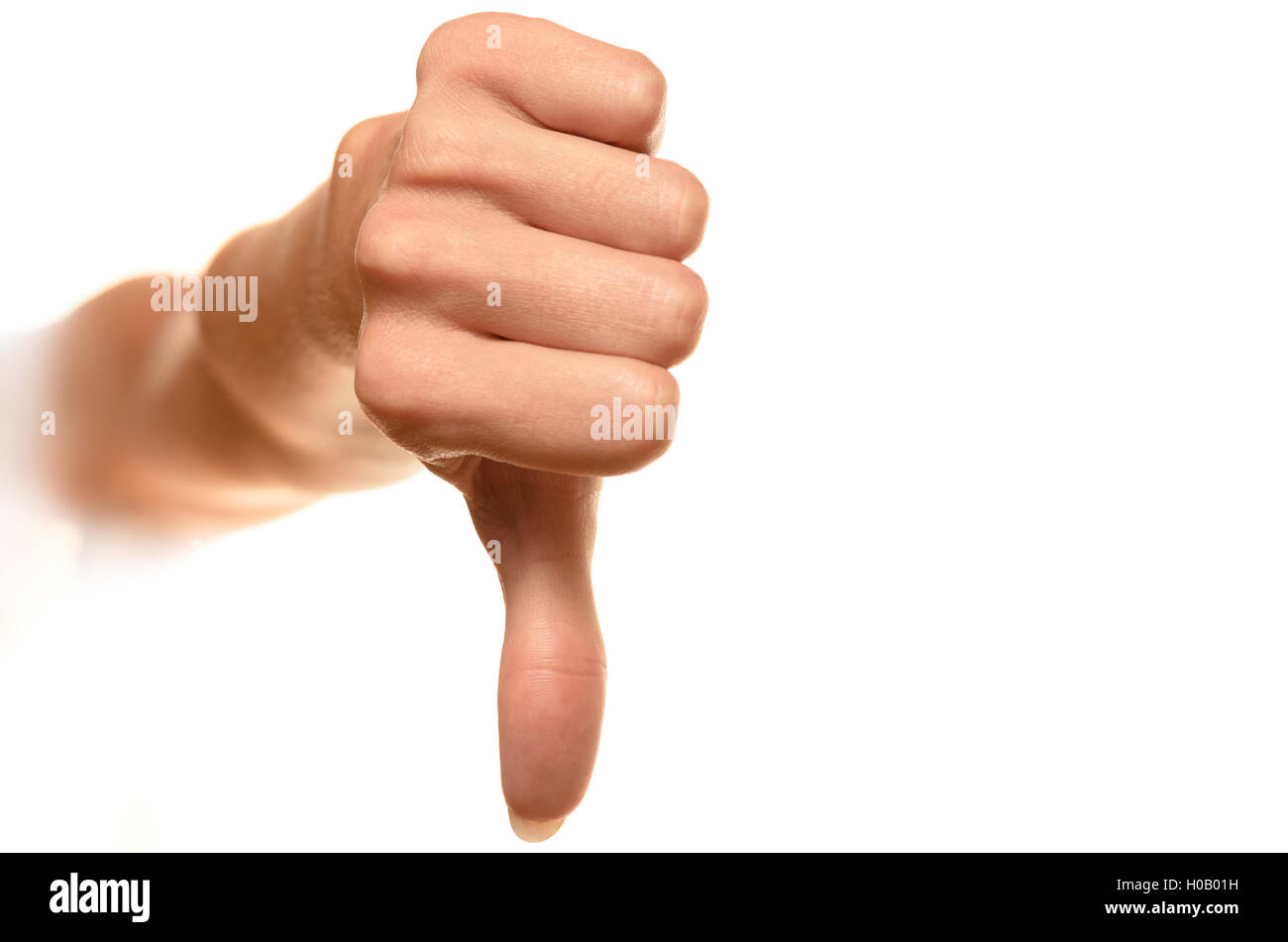 front view of female hand showing thumbs down sign against white ...