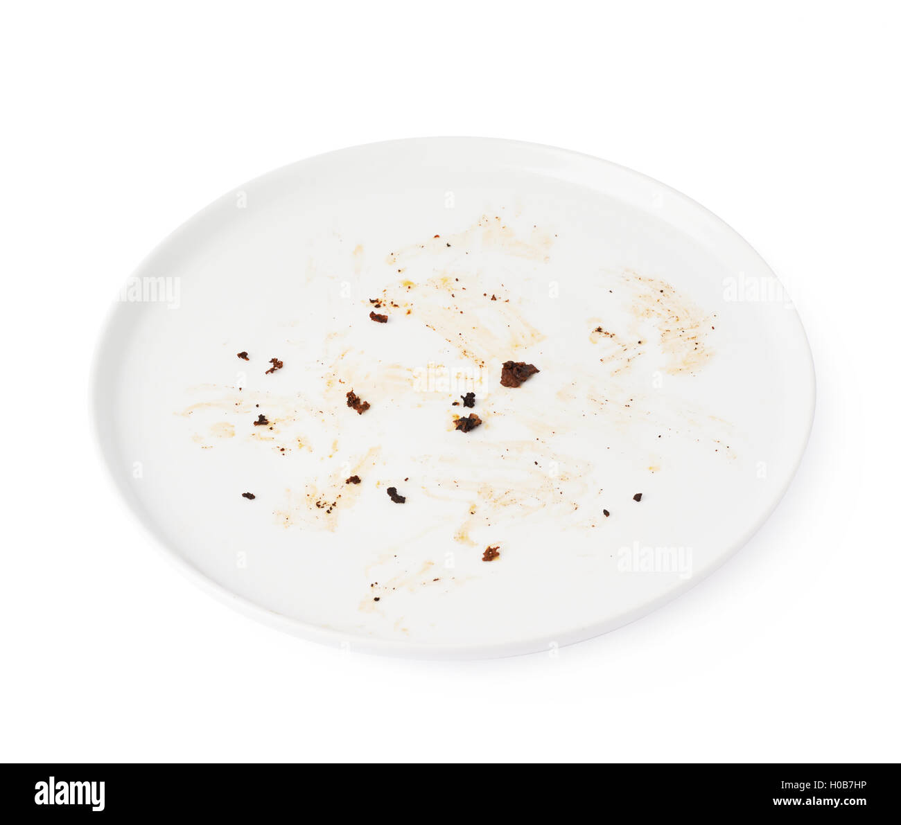 Dirty big plate over white isolated background Stock Photo - Alamy
