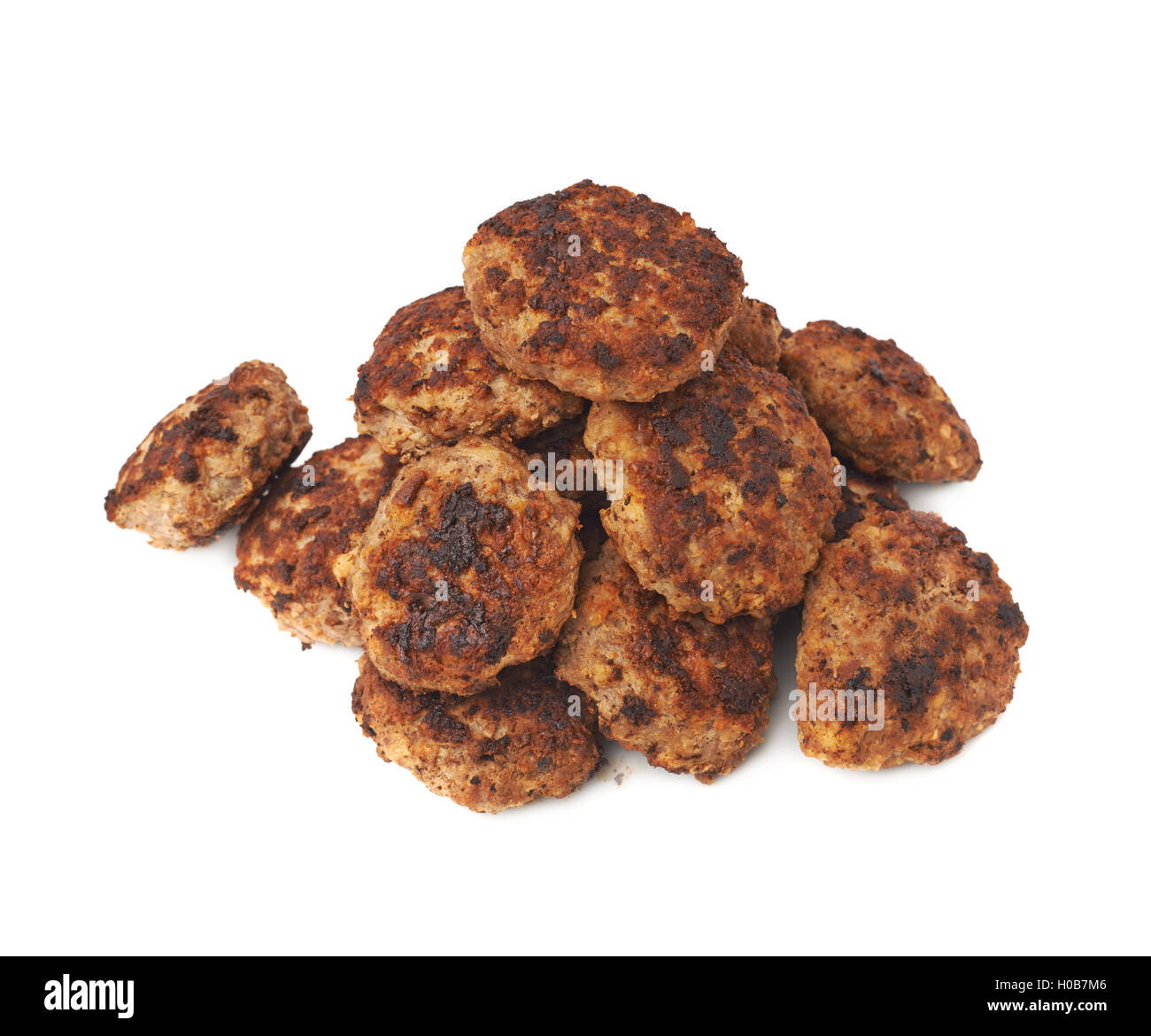 Pile of small hand made cutlets isolated over white background Stock ...