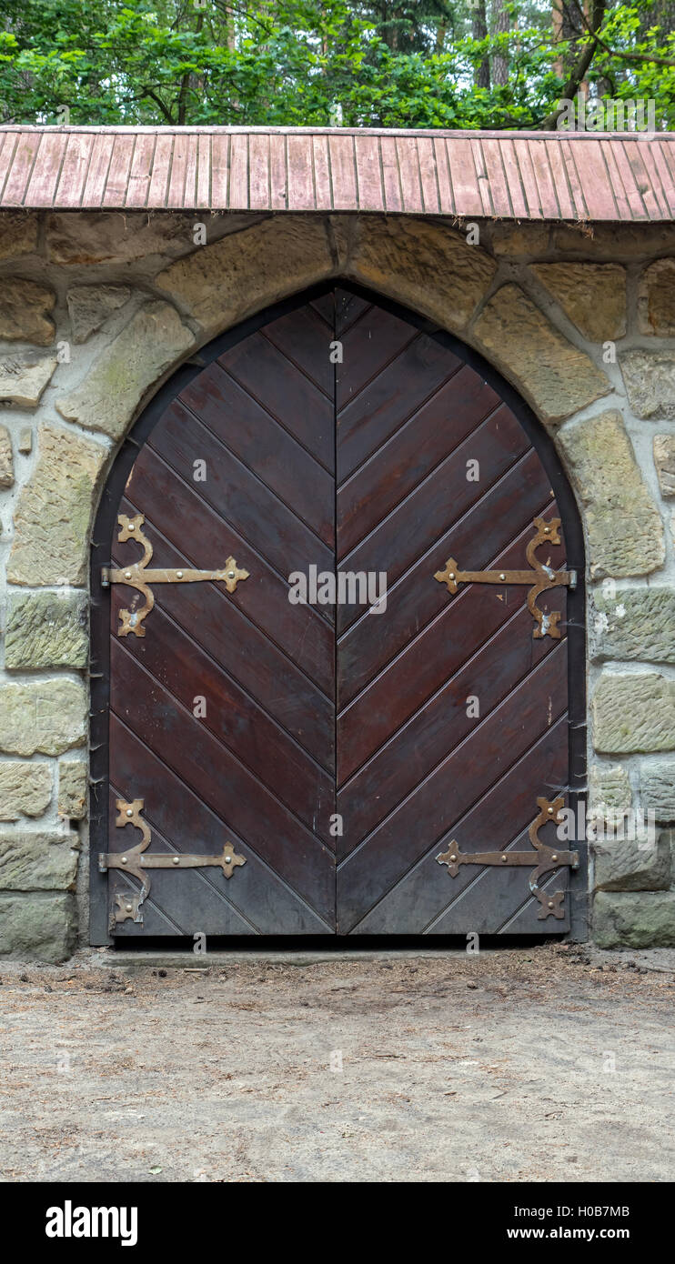 Medieval gate in a stone wall Stock Photo - Alamy