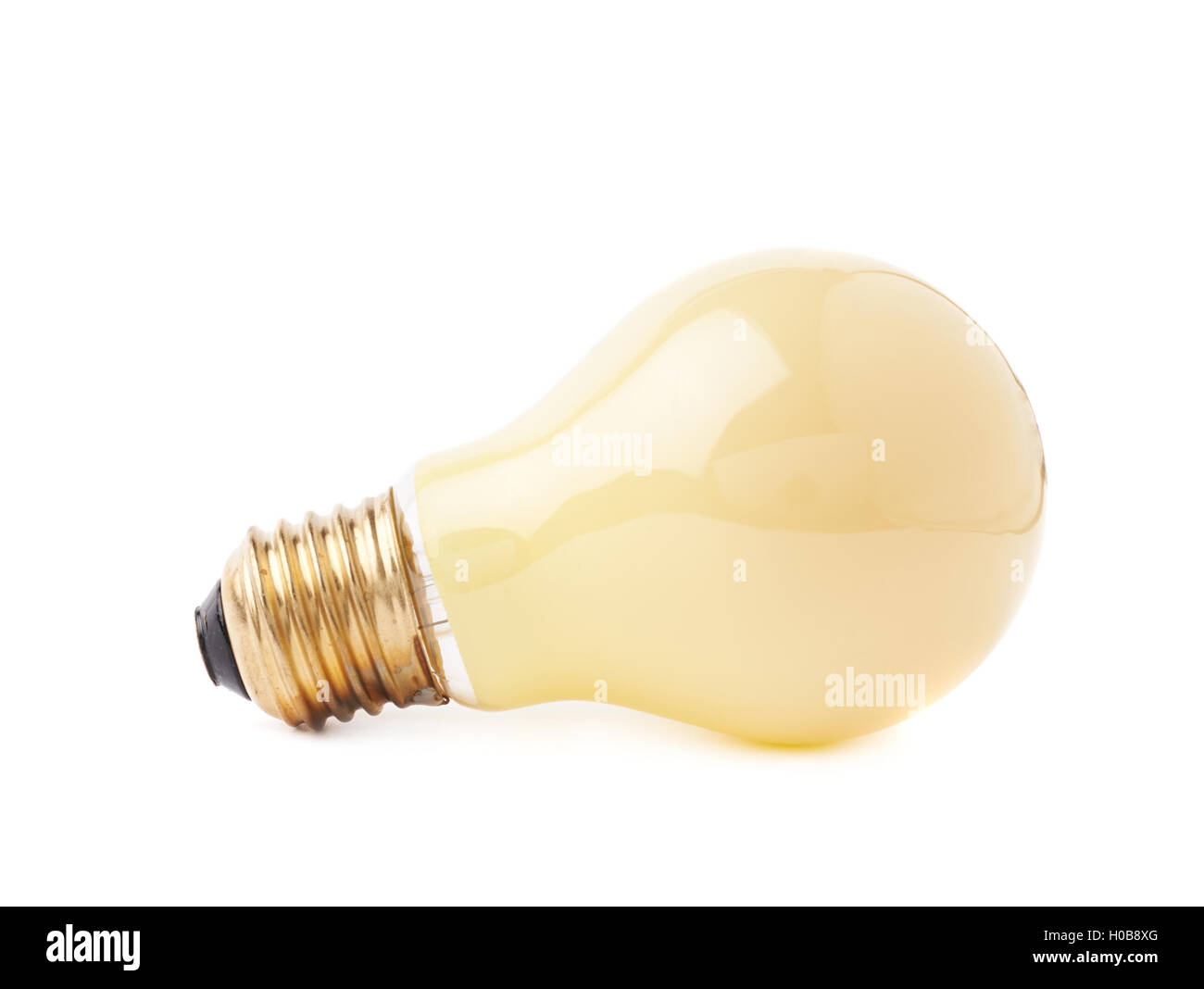 Single electric bulb lying on its side, isolated over the white ...