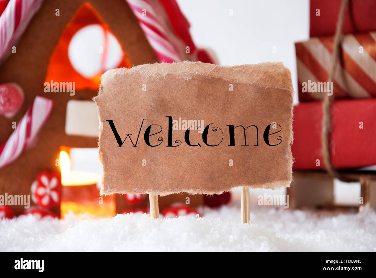 Gingerbread House With Sled, Text Welcome Stock Photo - Alamy
