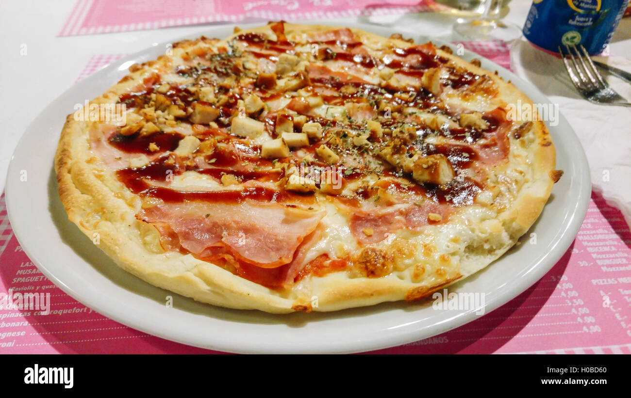Tasty pizza in the table of a restaurant Stock Photo - Alamy