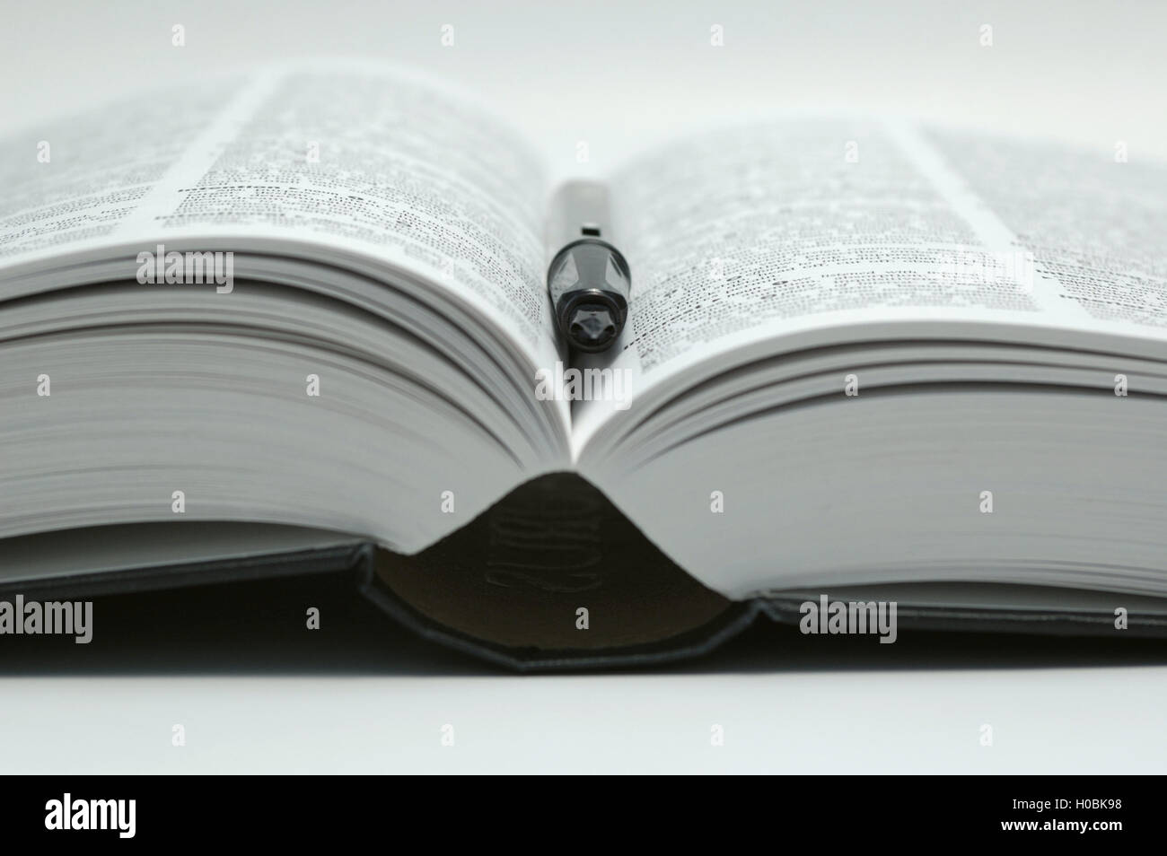 Pen in Dictionary Stock Photo - Alamy