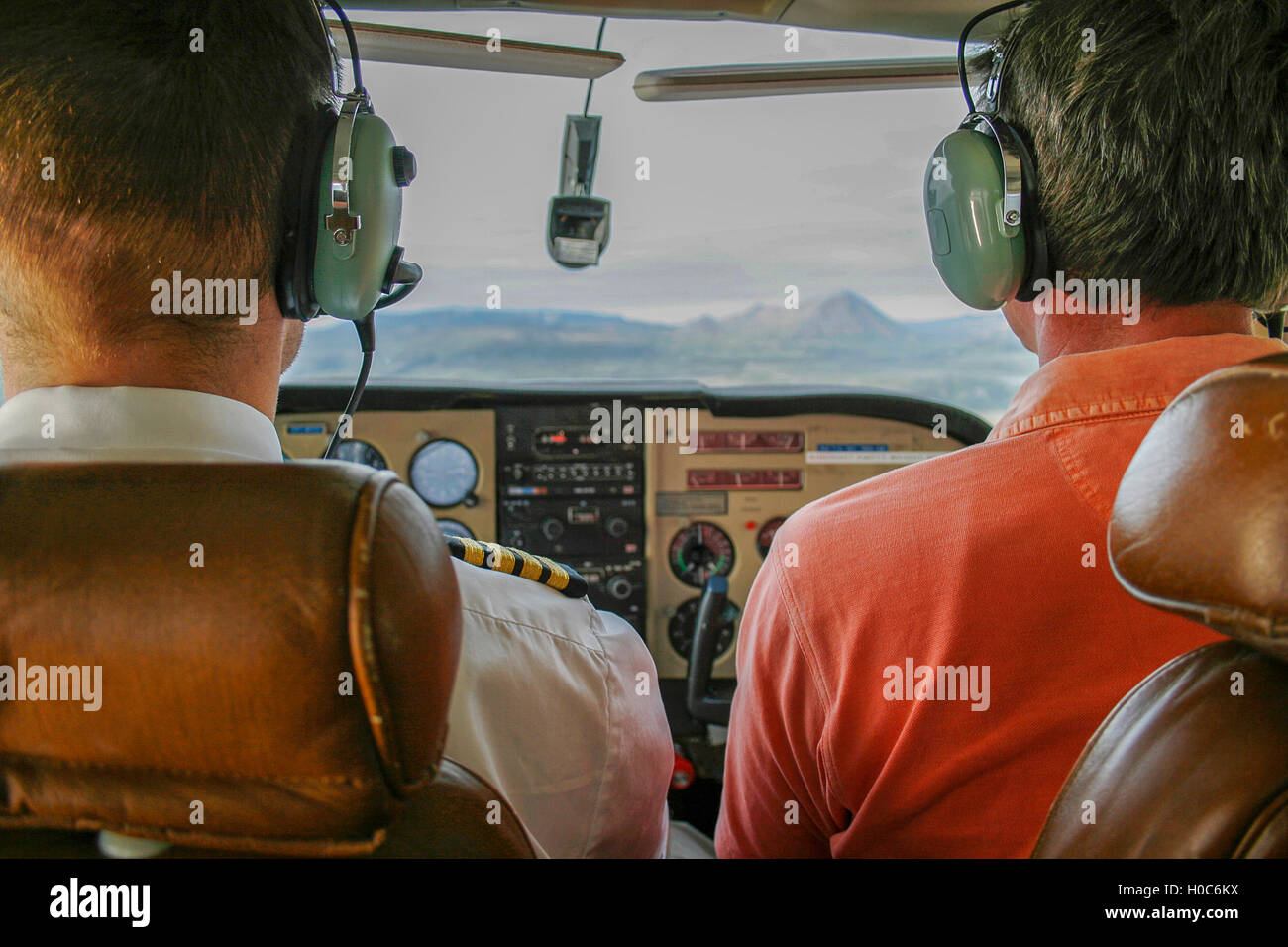 Two men in cockpit of small plane Stock Photo - Alamy