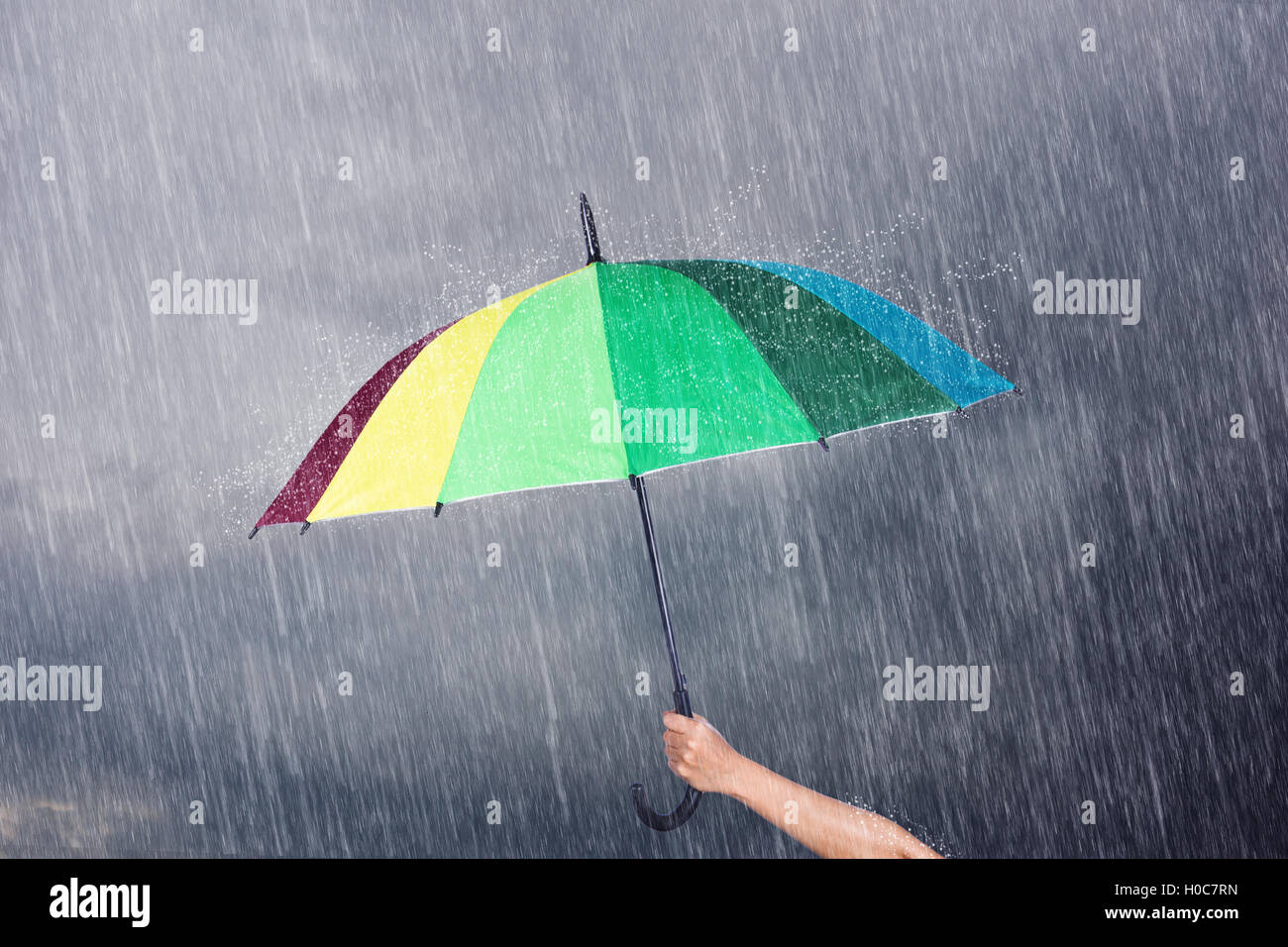 Woman umbrella rain storm hi-res stock photography and images - Alamy