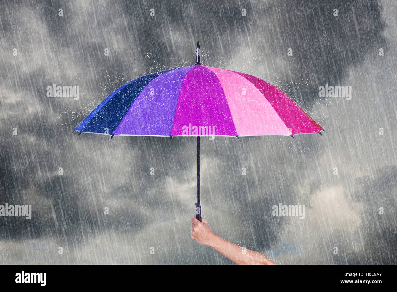 Woman umbrella rain storm hi-res stock photography and images - Alamy