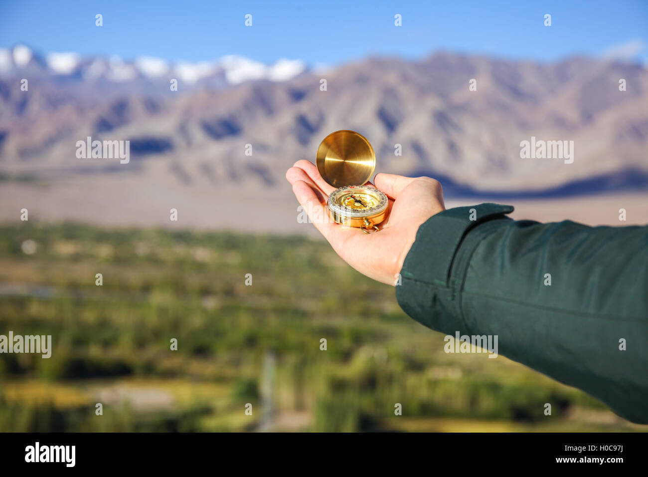Man using compass on map hi-res stock photography and images - Alamy