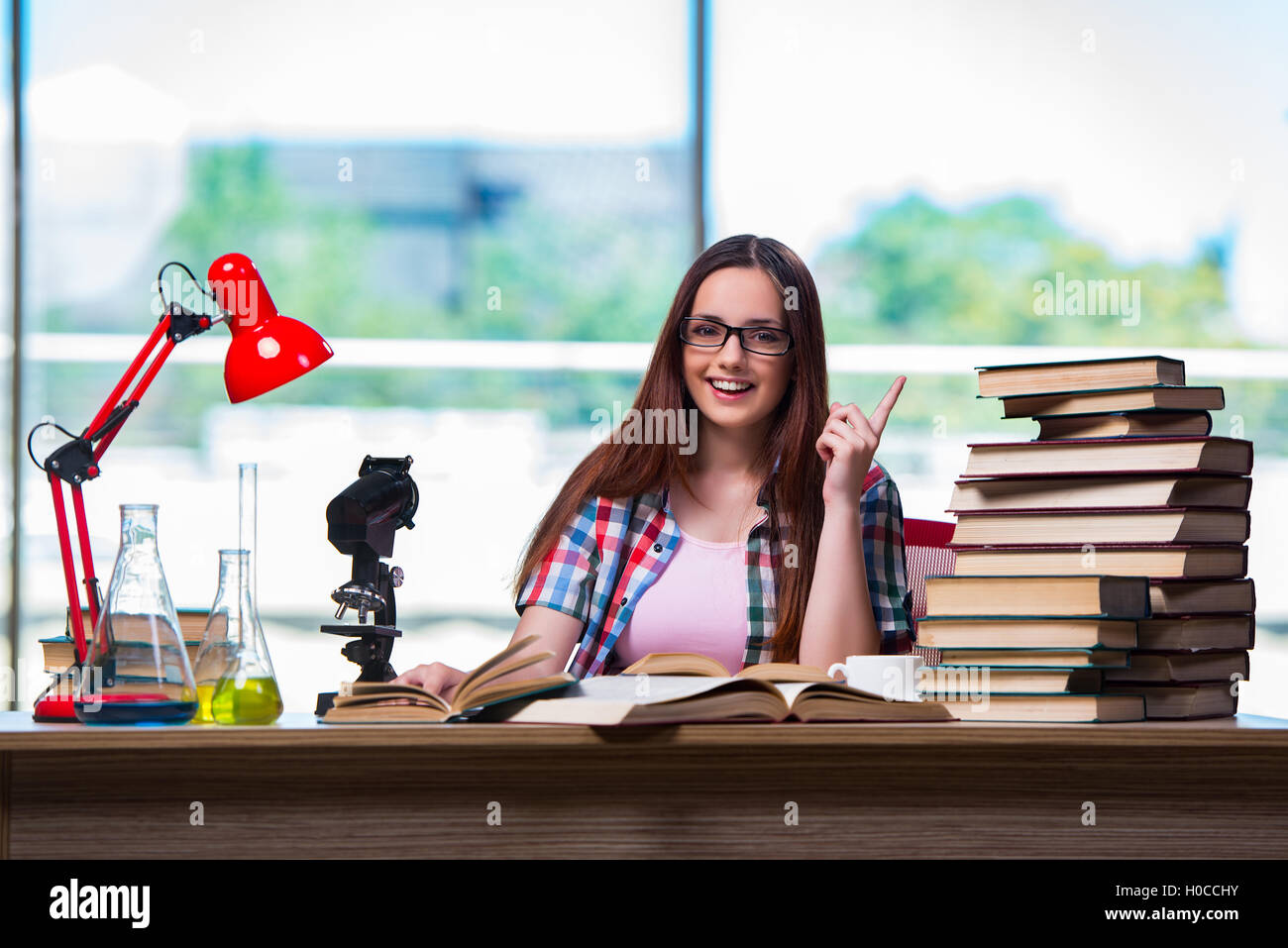 Female student preparing for chemistry exams Stock Photo - Alamy