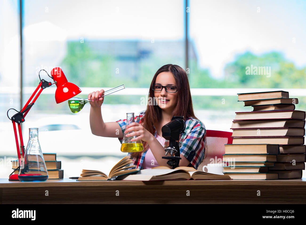 Female student preparing for chemistry exams Stock Photo - Alamy