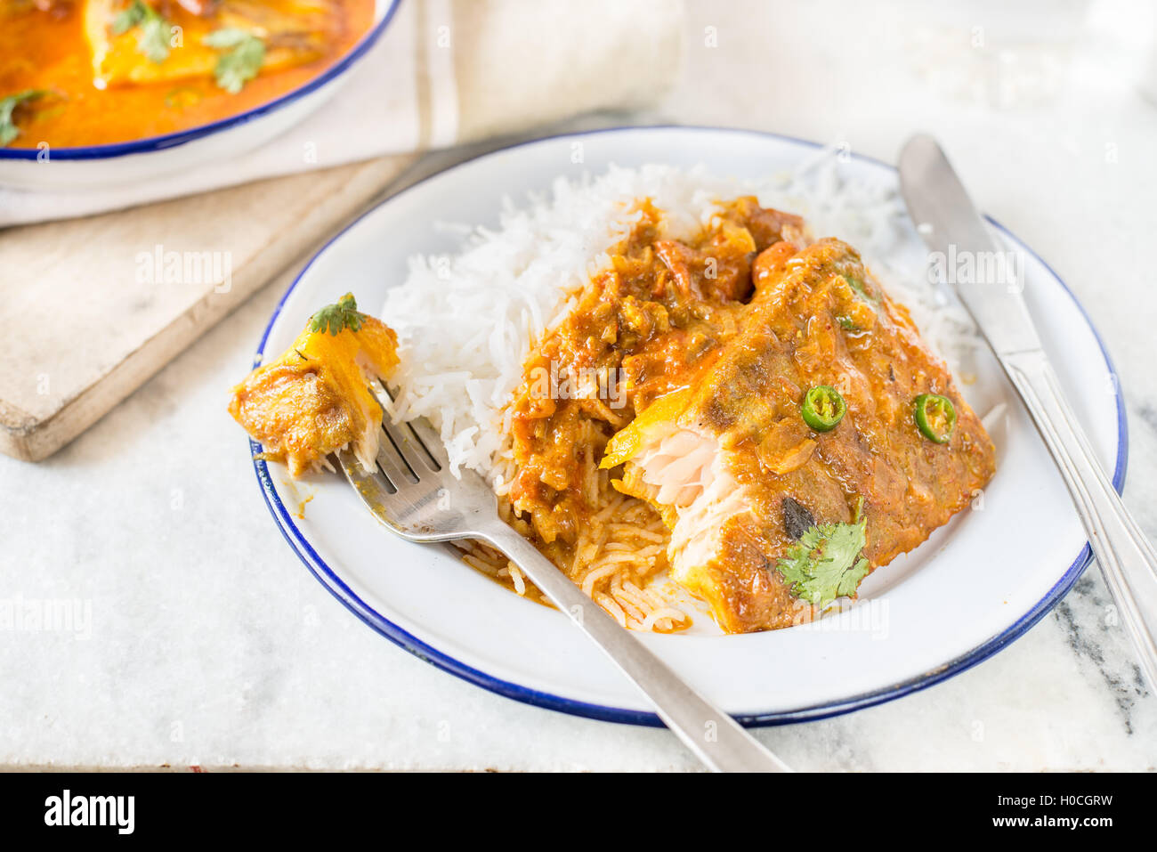 Fish In Curried Coconut Sauce Recipe in Indian style Stock Photo - Alamy