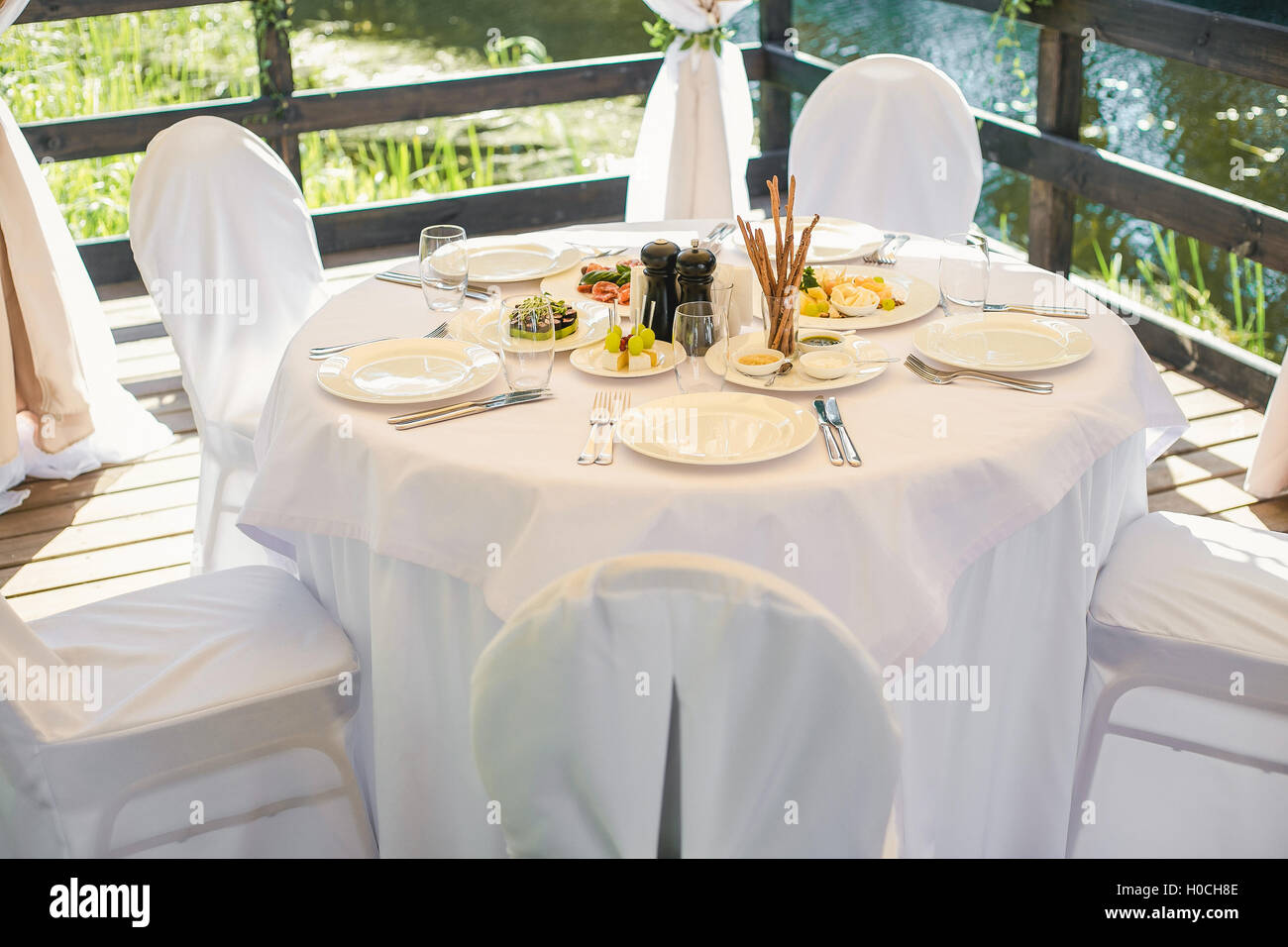 Beautifully decorated catering banquet table with different food snacks ...
