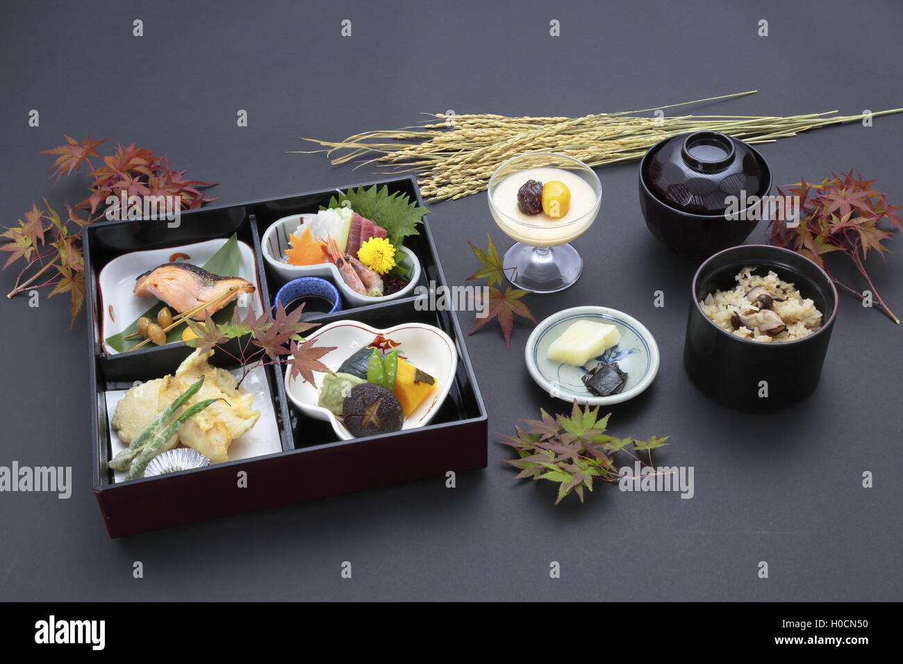 Bento and tray meal of Japanese style with rice, sushi and soy sauces ...