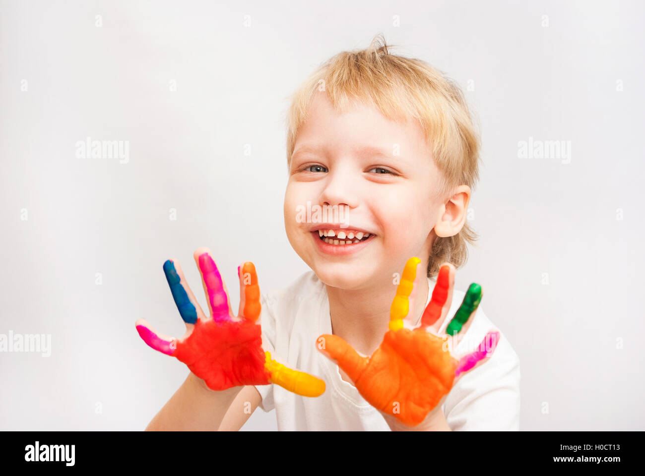 little boy hands painted in colorful paints Stock Photo - Alamy