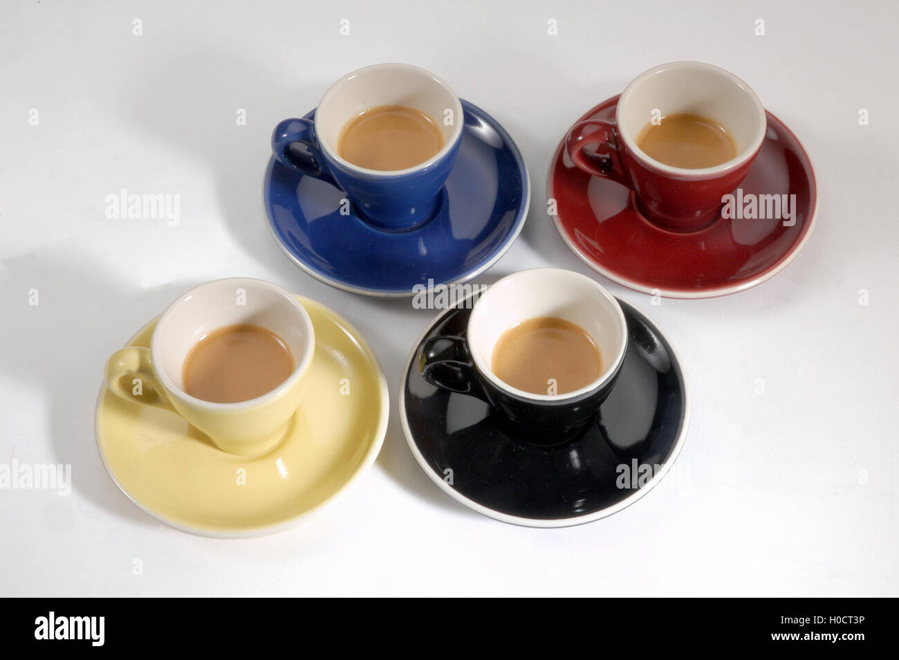 4 cups of coffee colored Stock Photo - Alamy