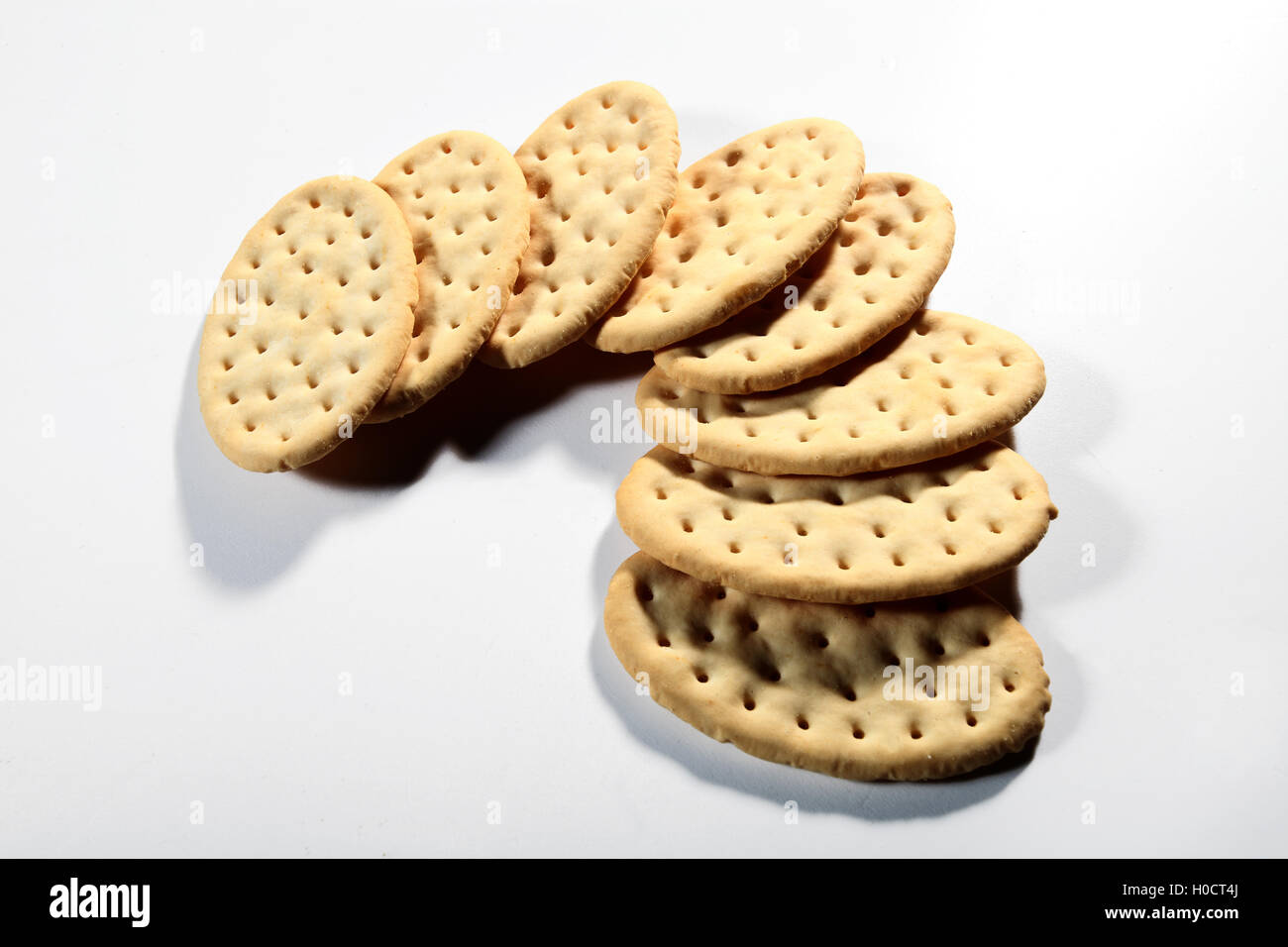 group of crackers in a semicircle on white background Stock Photo - Alamy