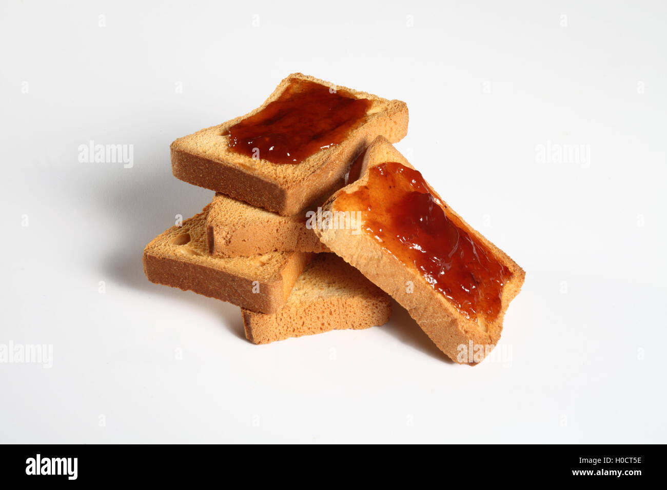 group of five biscuits with jam on a white background Stock Photo - Alamy