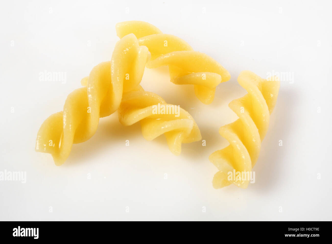 fusilli on white background Stock Photo - Alamy