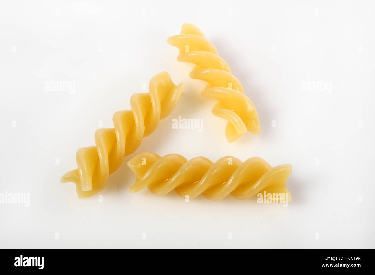 fusilli on white background Stock Photo - Alamy