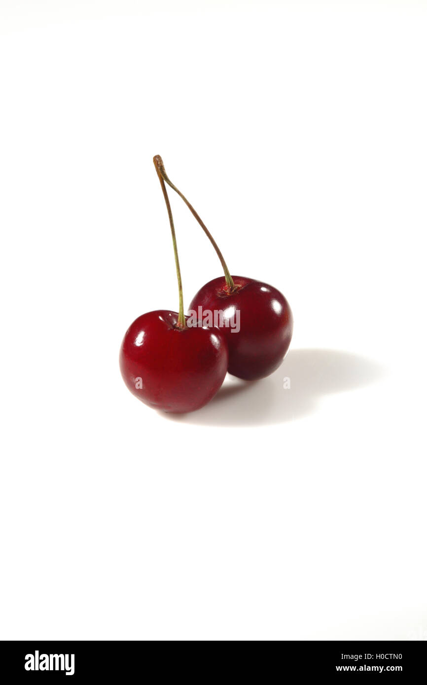 two sweet cherry isolate on white background Stock Photo - Alamy