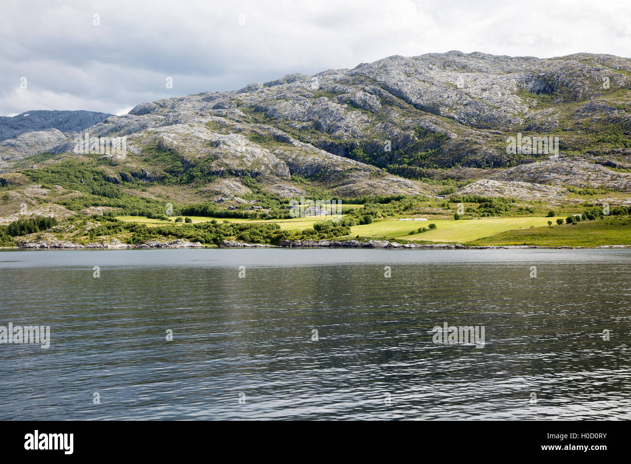 Rocky coastal rural farming landscape near Sandnessjoen, Nordland ...