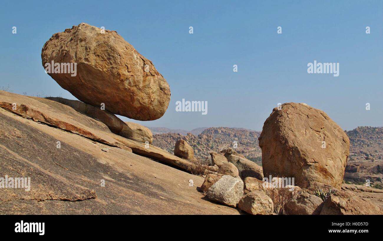 Big balancing granite boulder in Hampi, India. Popular region for rock ...