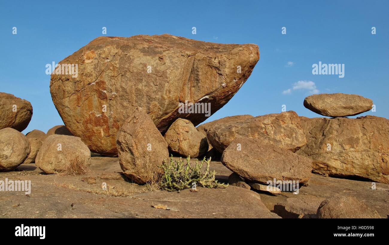 Big granite boulder and smaller balancing granite boulder on the left ...
