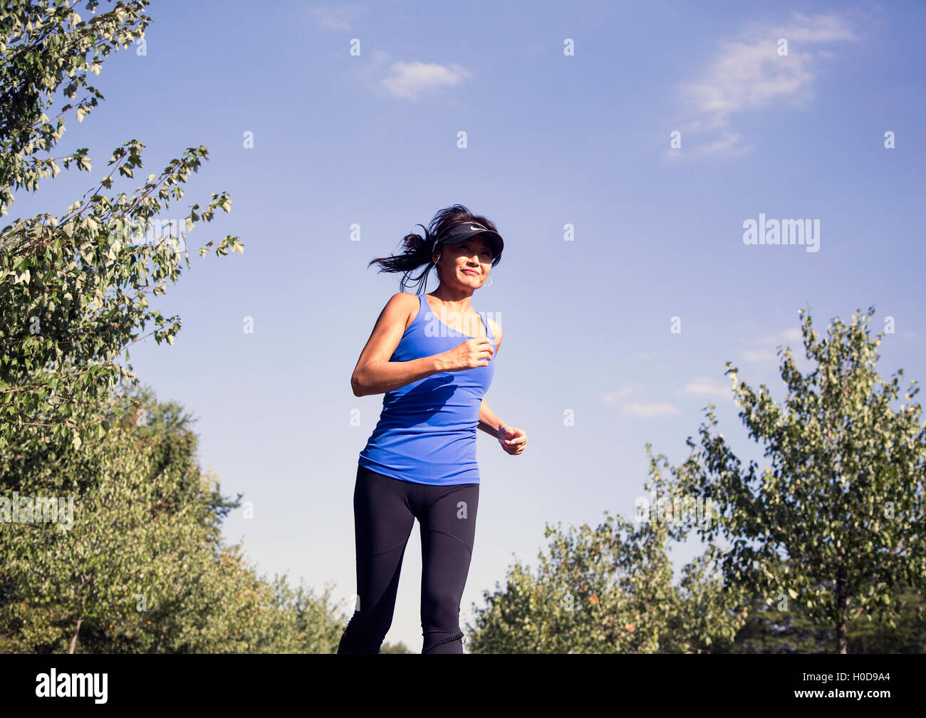 Female runner park hi-res stock photography and images - Alamy