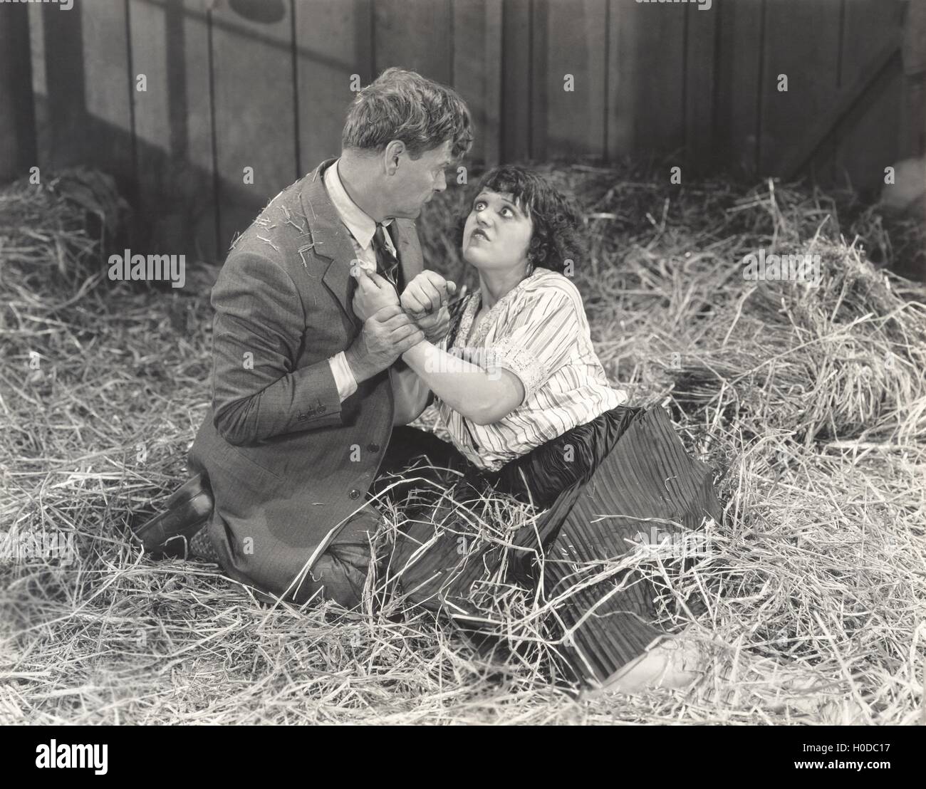 Couple fighting in barn Stock Photo - Alamy