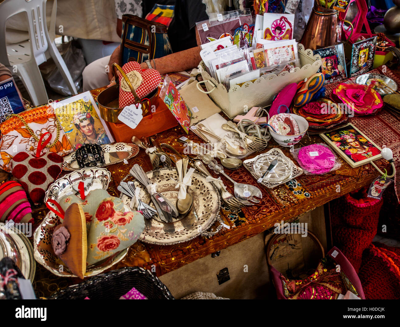 Trinkets, seconds and other collectables on sale in a market stall ...