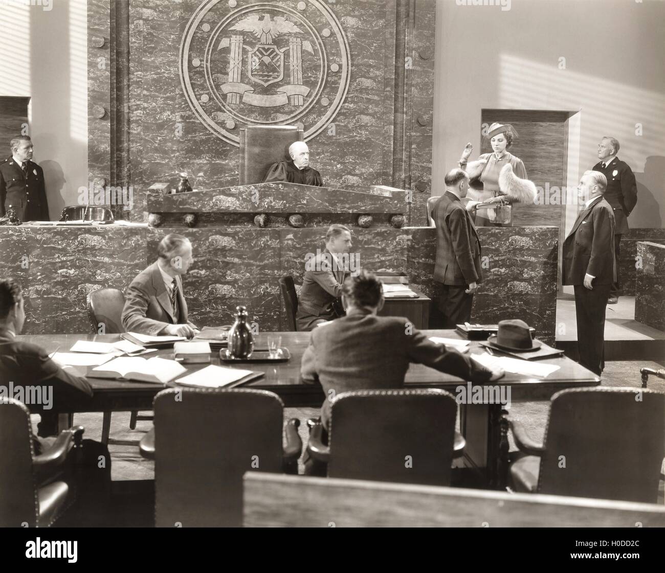 Swearing in the witness Stock Photo - Alamy
